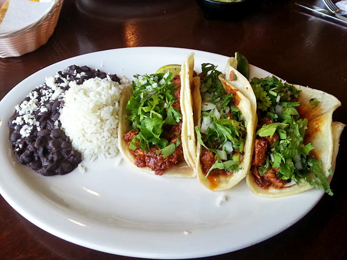 Al Pastor tacos that respect tradition&mdash;simple, vibrant, and unapologetically flavorful, served with the cilantro rice and beans they deserve.