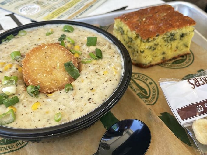 A bowl of Tampa corn chowder that whispers, "Cancel your afternoon plans." That cornbread square isn't a side&mdash;it's an essential dipping tool.
