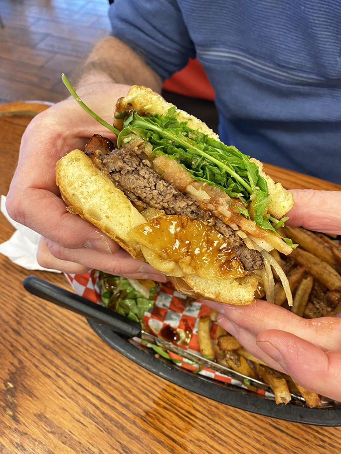 This isn't just a burger&mdash;it's edible architecture. Layer upon layer of flavor held together by a bun that somehow defies structural physics.