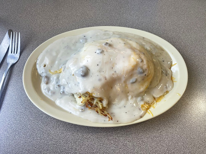 The hash brown-omelet-biscuit trinity that makes you question why you'd ever eat anything else before noon. Breakfast architecture that defies both gravity and restraint.