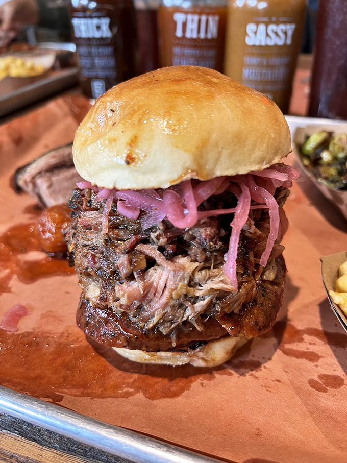 The Tres Hombres sandwich doesn't just feed you&mdash;it transforms you. Those pink pickled onions cut through the richness like a well-timed punchline.