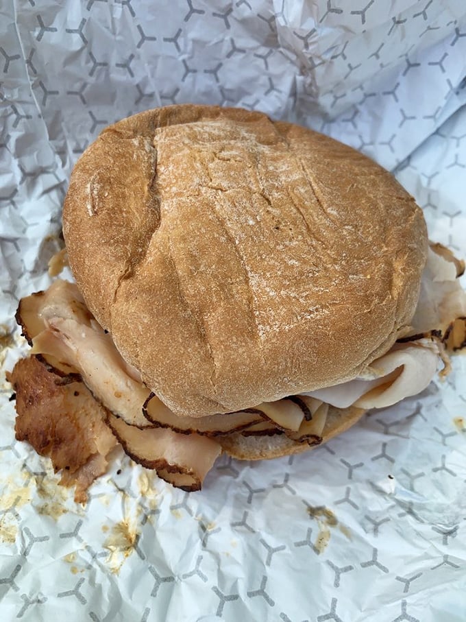 The turkey sandwich might be the unsung hero here—thick-sliced, smoke-kissed poultry stacked generously on a roll that knows its supporting role.