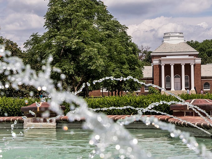 Classical columns and dancing fountains create a timeless atmosphere at the University of Delaware, where history and innovation coexist beautifully. 