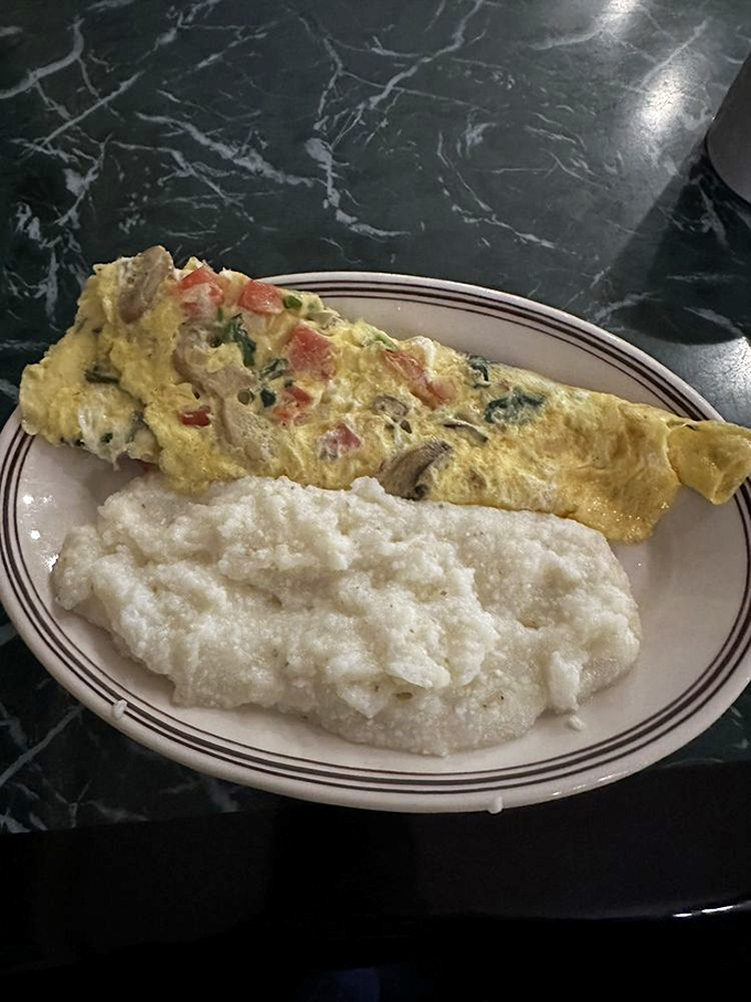 This omelet and grits combo isn't just breakfast&mdash;it's a Southern sunrise on a plate, ready to brighten your entire day.