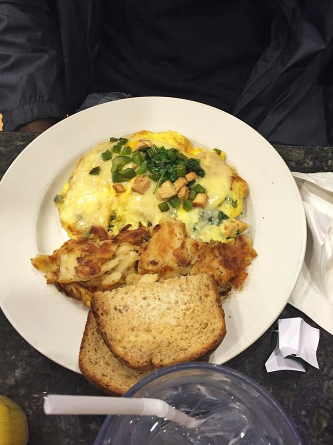 Green means go! This veggie-packed omelet proves healthy can be indulgent. Those home fries and toast aren't just sidekicks&mdash;they're essential companions.