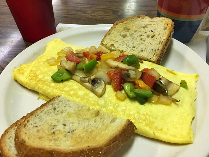 This veggie omelet doesn't just eat its vegetables—it celebrates them with a confetti of peppers, mushrooms, and onions folded into fluffy egg perfection.