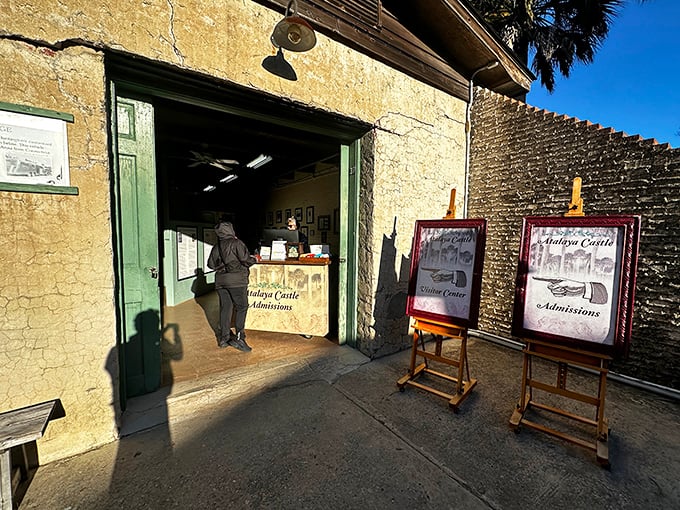 Step back in time at Atalaya's visitor center, where history awaits behind weathered walls and green-trimmed doorways.
