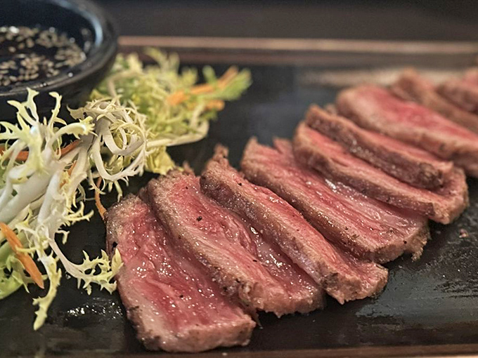 Sliced with precision that would make a surgeon jealous, this Wagyu reveals marbling so beautiful it deserves its own art exhibition.
