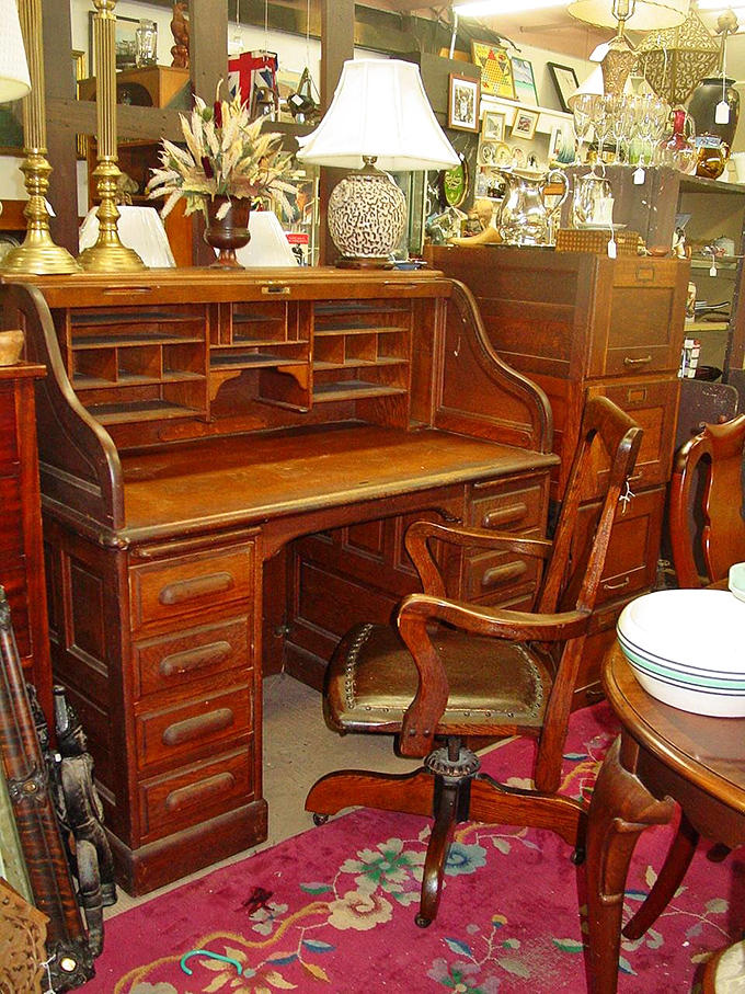 This roll-top desk has probably witnessed the writing of love letters, business deals, and family budgets across generations of New England homes.