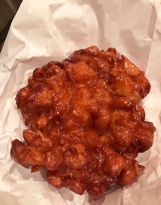 Not so much a fritter as a monument to apple-cinnamon genius, with crispy edges that crackle like autumn leaves underfoot.