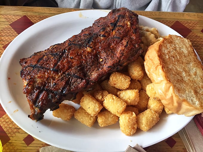 These ribs have clearly been introduced to heat and smoke with the patience of a true pitmaster. Tater tots provide the perfect crispy contrast.