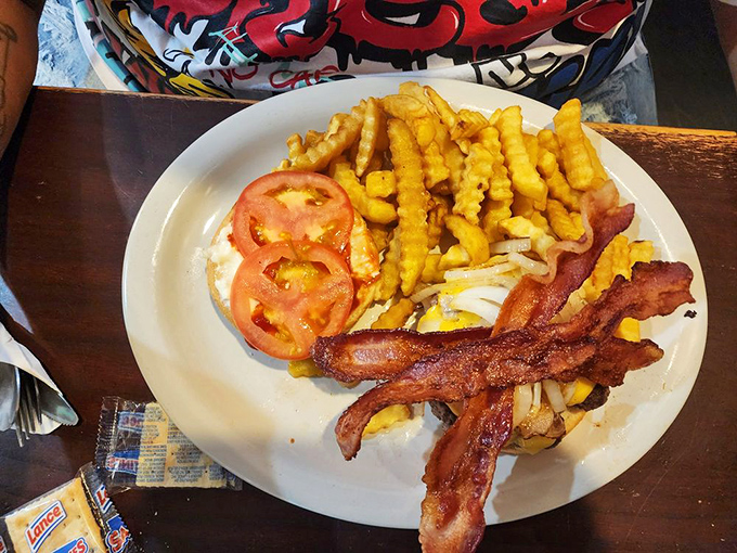 Behold the breakfast of champions&mdash;crispy home fries topped with melted cheese and what appears to be diced ham, comfort food at its finest.