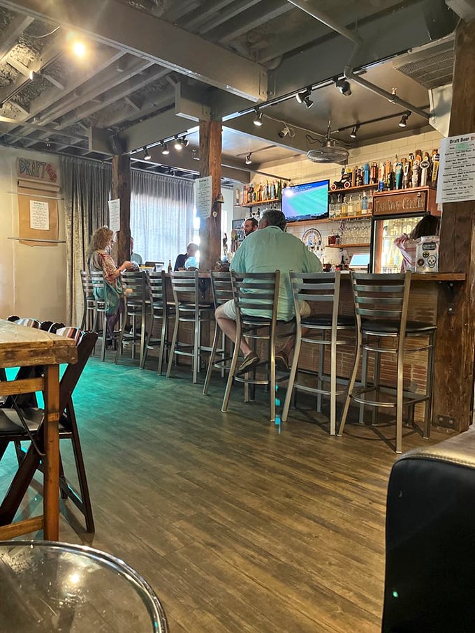 The bar area transforms from daytime coffee spot to evening gathering place, where locals debate everything from plot twists to politics.