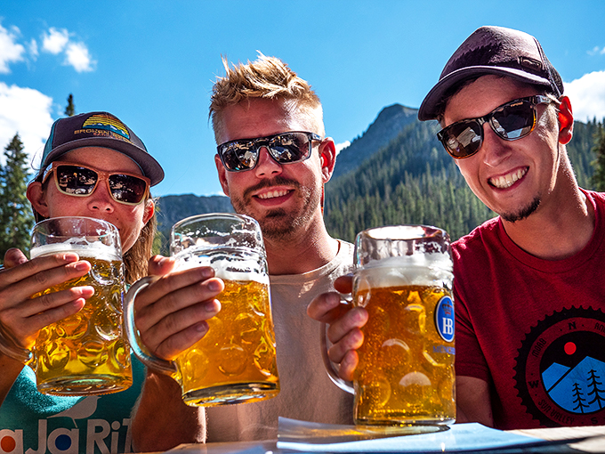 Three steins raised against a mountain backdrop&mdash;this is what vacation memories are made of, one perfectly poured beer at a time.
