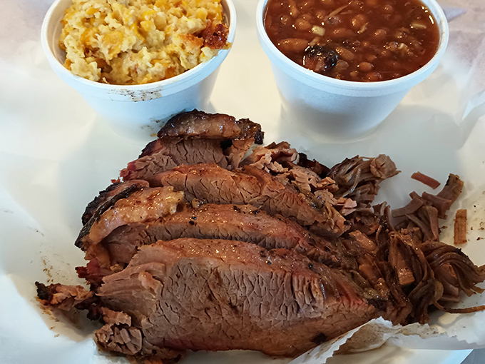 Brisket with that telltale pink smoke ring, beans with substance, and mac and cheese that's worth every calorie-laden bite.