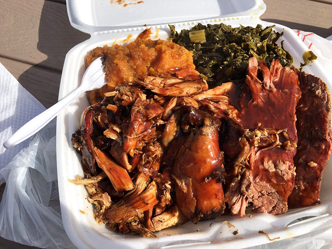 Southern comfort on a plate. The collards, sweet potatoes, and various meats create a harmony that would make a gospel choir jealous.