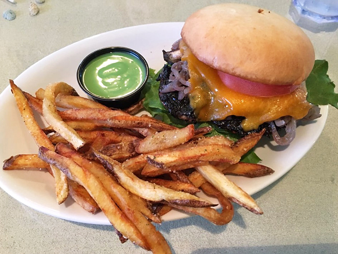 A burger this perfectly stacked deserves its own architectural award, with a side of hand-cut fries that put fast food to absolute shame.