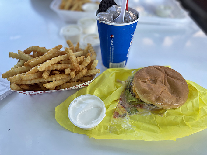 Crinkle-cut fries that could make a French culinary school graduate weep with joy, paired with a burger that doesn't need Instagram filters.