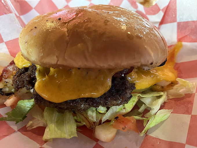 This isn't just a cheeseburger; it's edible architecture where every ingredient plays its part in a symphony of flavor.