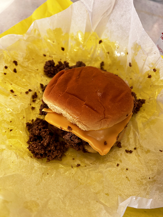 The cheese version elevates the classic with melty American goodness, creating pockets of creamy contrast to the savory seasoned beef.