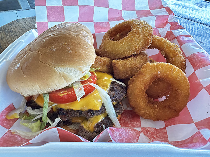 The burger-and-rings basket arrives on red-checkered paper&mdash;a delicious reminder that some traditions are worth preserving.