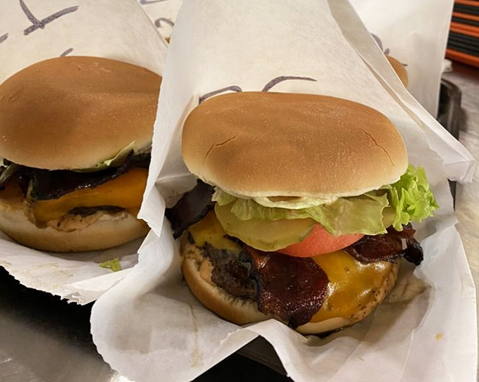 Two burgers wrapped in paper, like presents waiting to be unwrapped. The anticipation is half the fun&mdash;but only half.