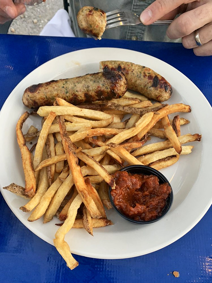 These bratwursts have the perfect snap and char marks that whisper, "Yes, this is the real deal." Paired with crispy fries and house-made sauce.