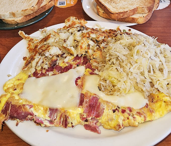 This isn't just an omelet&mdash;it's a commitment. Corned beef and cheese nestled in eggs with those famous hash browns standing guard.