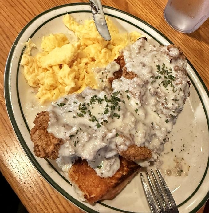 Country fried steak smothered in gravy with scrambled eggs on the side. When your breakfast needs to apologize to your arteries but delight your soul.