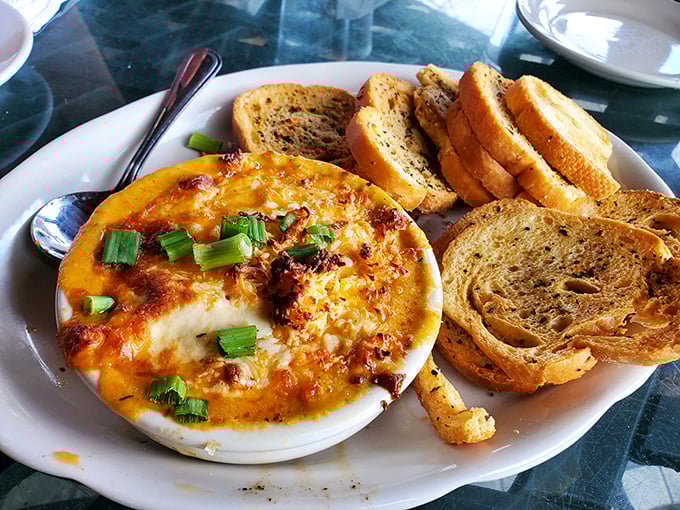 A bubbling bowl of cheesy goodness that demands to be shared. Though after one bite, sharing might become a theoretical concept.
