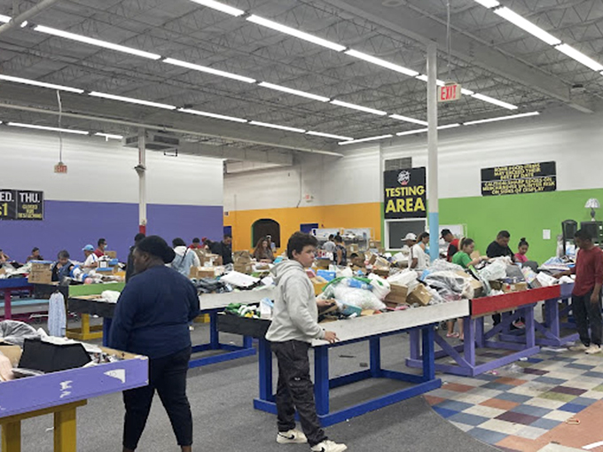 The universal language of a great find&mdash;shoppers navigate the colorful maze of bins with the focus of detectives on a case.