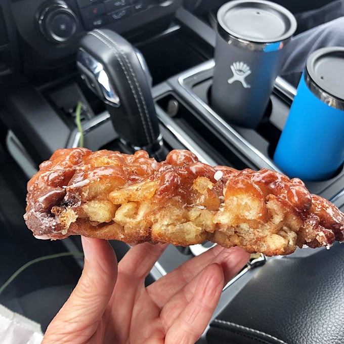 The cross-section reveals the truth – layers of dough, pockets of apple, and a glaze that shatters like candy. This isn't breakfast; it's edible architecture.