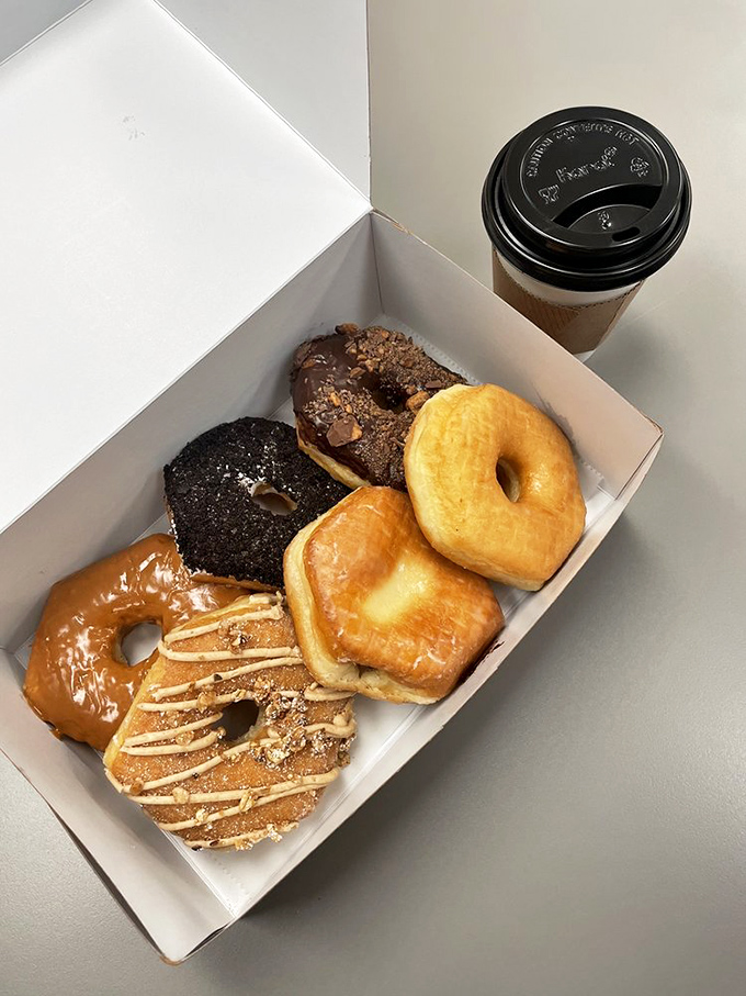 A dozen reasons to skip your morning meeting. The lime green frosted one is practically calling your name from the box.