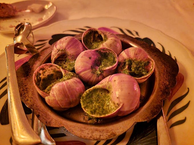 Escargot: where garlic butter meets garden visitor. These little flavor bombs make you wonder why we don't eat more things drenched in herb butter.