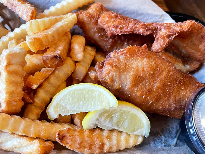 Fish and chips that would make a British pub jealous. Golden, crispy perfection with lemon wedges standing by for their supporting role.