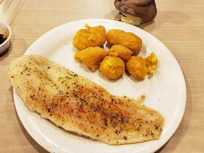 A perfectly seasoned fish fillet with a side of golden corn nuggets &ndash; proof that sometimes the simplest combinations deliver the most satisfaction.