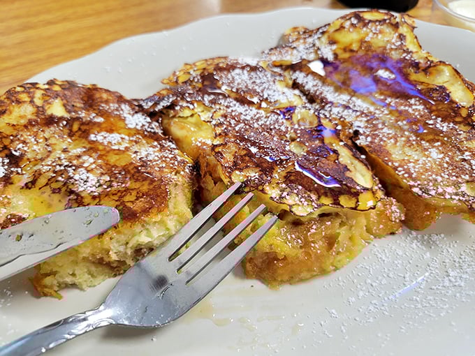 French toast that makes you question every other breakfast decision you've ever made. The dusting of powdered sugar is merely a formality.