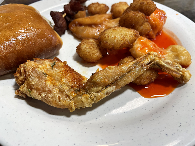 Golden-fried treasures nestled beside sweet-glazed chicken&mdash;a plate that whispers, "Go ahead, nobody's counting how many trips you make."