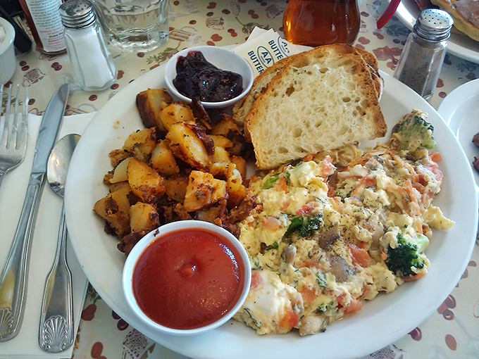 A scramble that contains more vegetables than most people eat in a day, served with potatoes that demand attention.
