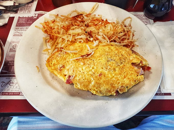 Sunshine yellow and perfectly folded, this omelet doesn't just feed your body &ndash; it feeds your soul. The hash browns are playing a supporting role worthy of an Oscar.