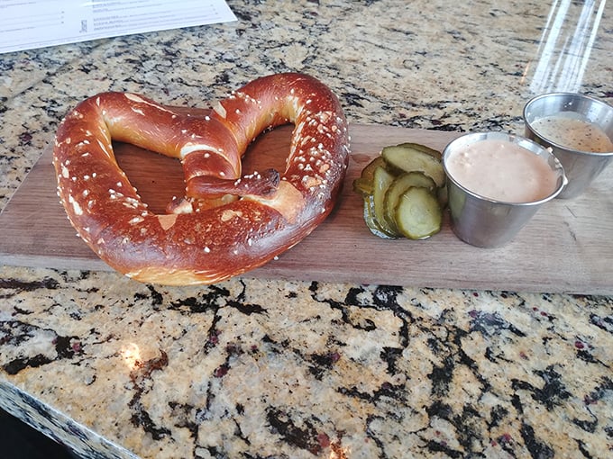 That pretzel has better posture than I've had in decades. The dipping sauces stand at attention, ready for their moment of glory.