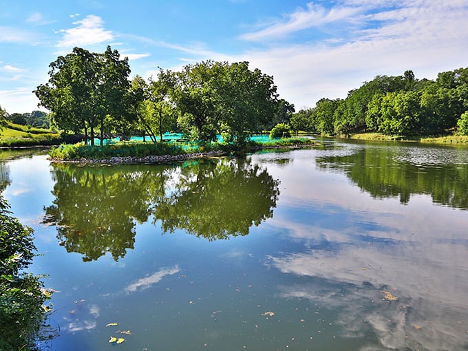 Mirror, mirror on the pond &ndash; even Minnesota's clouds seem to pause for a moment of self-reflection in these serene waters.