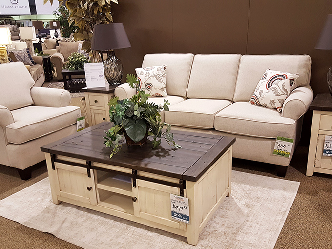 Farmhouse chic that doesn't scream "I watched too many renovation shows." The sliding barn door coffee table cleverly hides evidence of your Netflix binges.