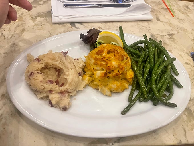 The holy trinity of Maryland dining: perfect crab cake, homestyle mashed potatoes, and green beans that actually taste like vegetables.