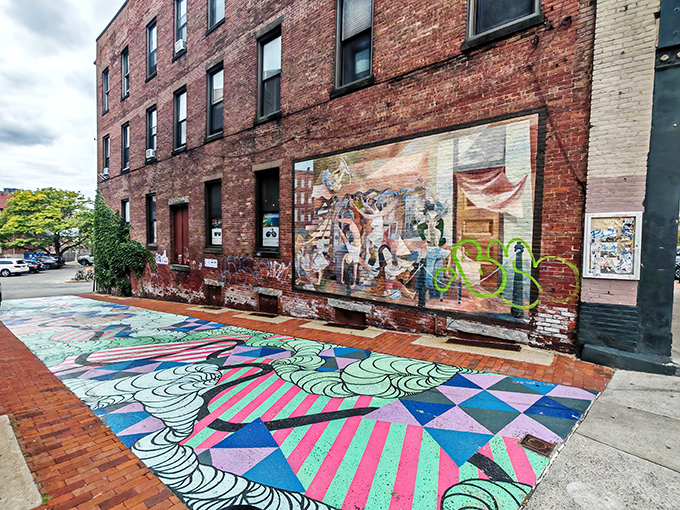 Street art transforms ordinary brick walls into community canvases. In Northampton, even the sidewalks get dressed up for the cultural party.