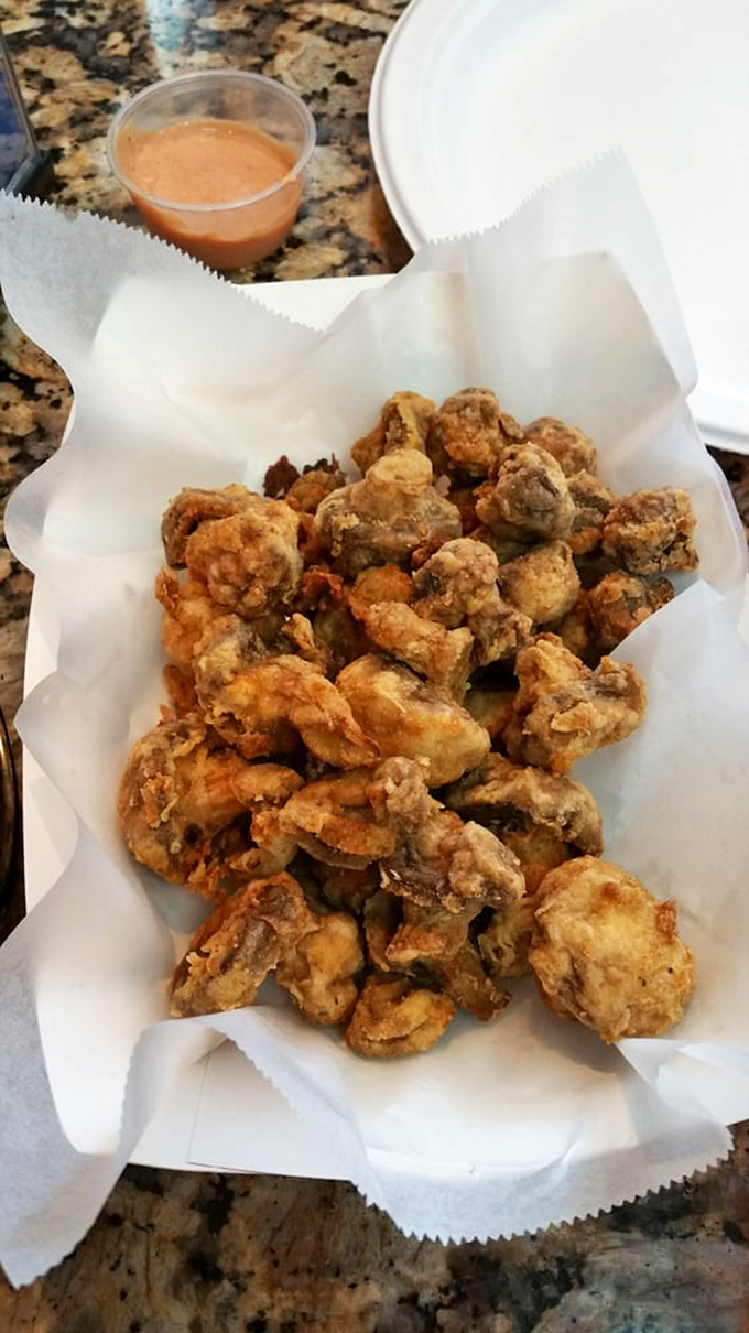 These aren't just mushrooms; they're little umami bombs wrapped in crispy jackets. The dipping sauce is merely a formality at this point.