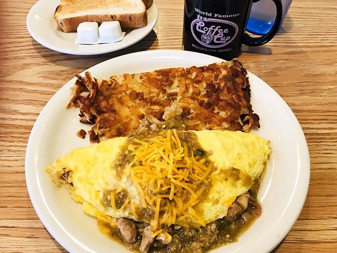 Breakfast alchemy at its finest. Green chili, eggs, and those golden-brown hash browns create a trio more harmonious than The Three Tenors.