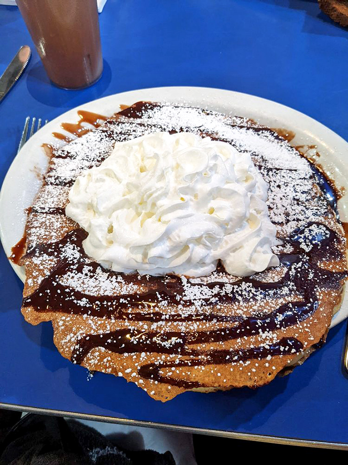 This isn't just a pancake&mdash;it's a dessert masquerading as breakfast. The whipped cream mountain makes morning feel like a celebration.