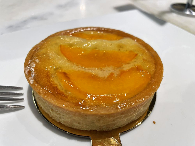 Peach tartelettes that capture Georgia's favorite fruit in a French accent &ndash; buttery crust cradling sunshine-sweet filling beneath a glossy glaze.
