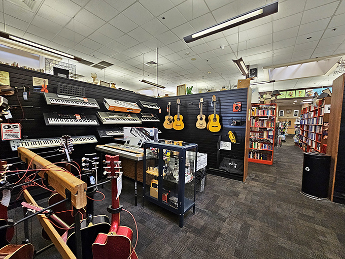 A keyboard lover's dream corner where forgotten pianos and synthesizers await their second act. The wall of guitars stands ready for aspiring rockstars.